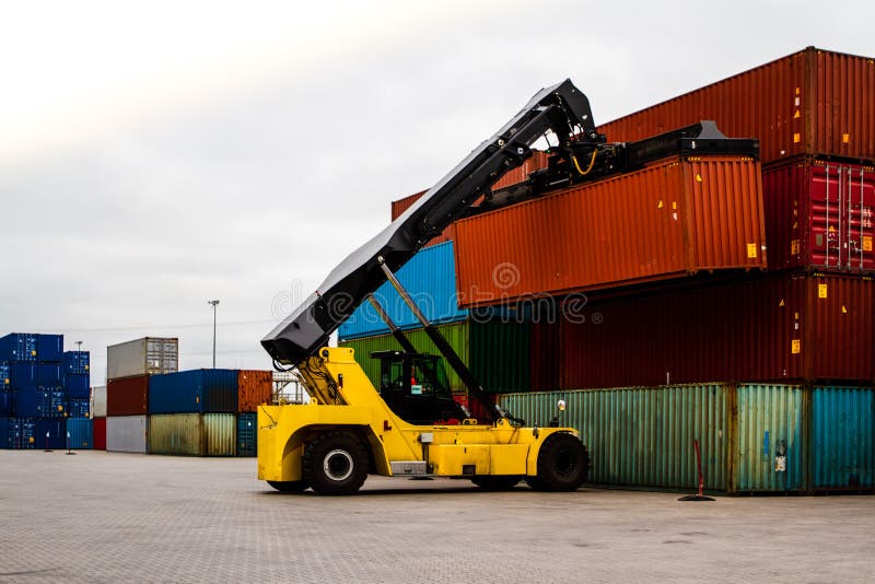 Forklift Handling Cargo Container. Freight Container Loading Stock ...