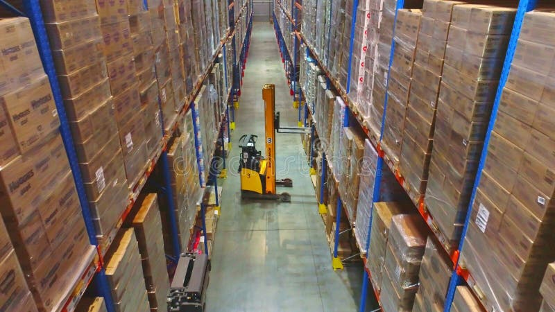 Warehouse Work. Modern Loaders in a Large Warehouse. Special Equipment ...