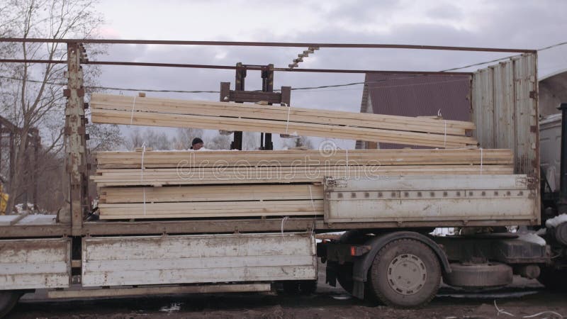 Forklift Load Stack of Lumber Planks on Wagon Lorry at Sawmill Factory ...
