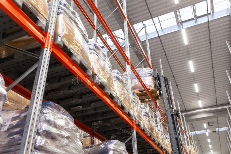 Forklift Loader Loading Cargo To Warehouse Shelves Stock Photo - Image ...