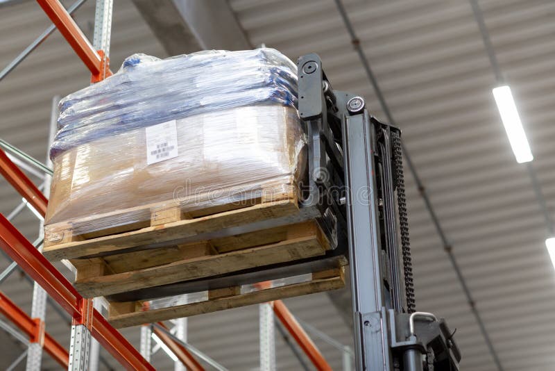 Forklift Loader Loading Cargo To Warehouse Shelves Stock Image - Image ...