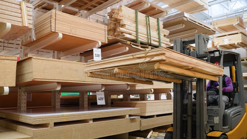 Warehouse Worker Driver in Uniform Loading Lumber by Forklift Stacker ...