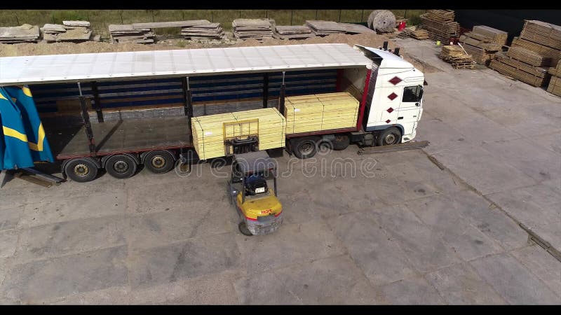 Forklift Loads the Truck into the Truck, Loading the Truck with Cargo ...