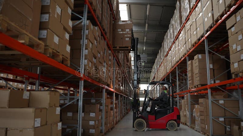 Forklift Operator Placing Load on Shelf in Storage Stock Video - Video ...