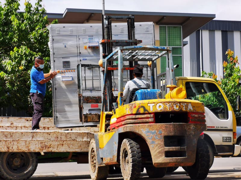 Forklift Operator Loading Switchboard at the Back of Lorry on June 6th ...