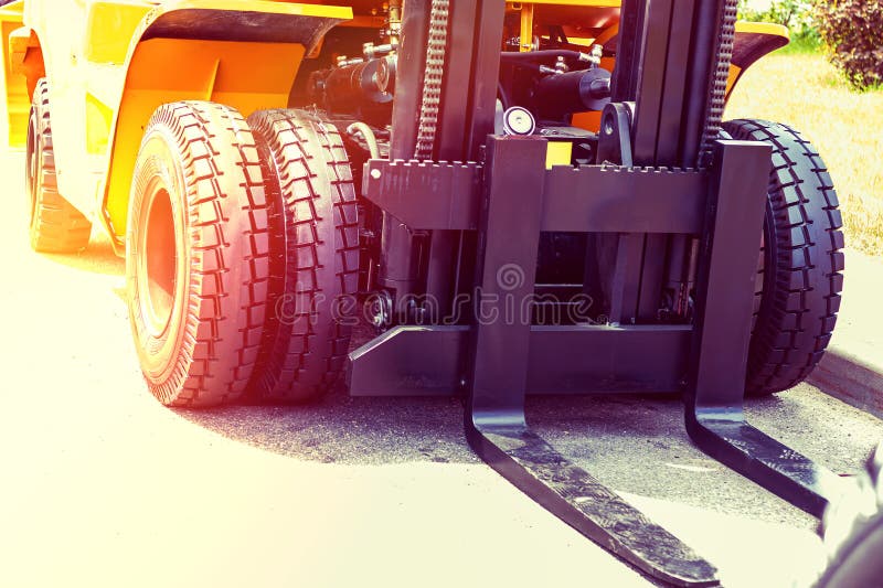 Forklift Unloading Cargo on a Sunny Day at a Warehouse Facility Near ...