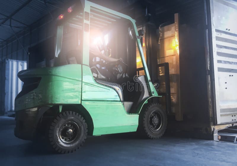 Forklift Tractor Loading Package Boxes into Cargo Container. Truck ...
