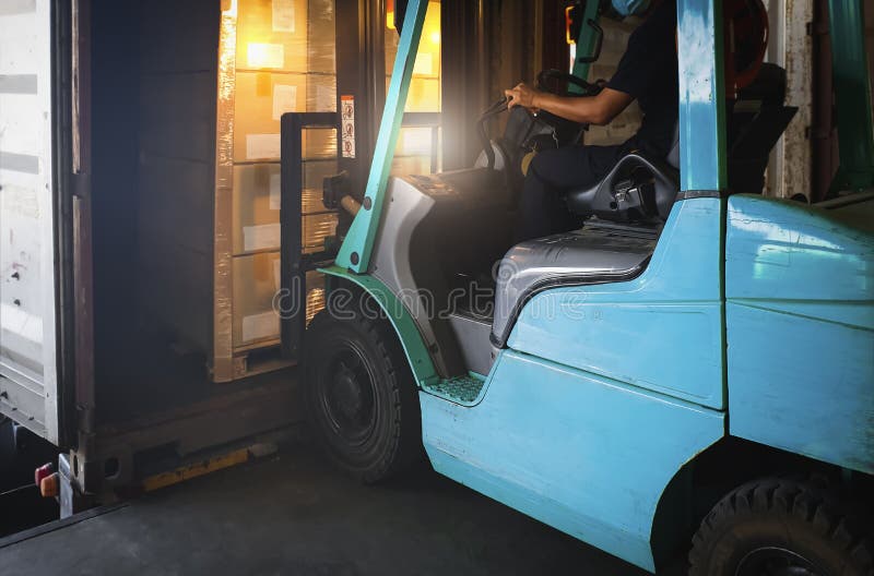 Forklift Tractor Loading Packaging Boxes into Container Trucks ...