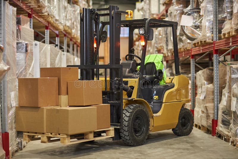 Forklift Truck Carrying Boxes in Warehouse Editorial Stock Image ...