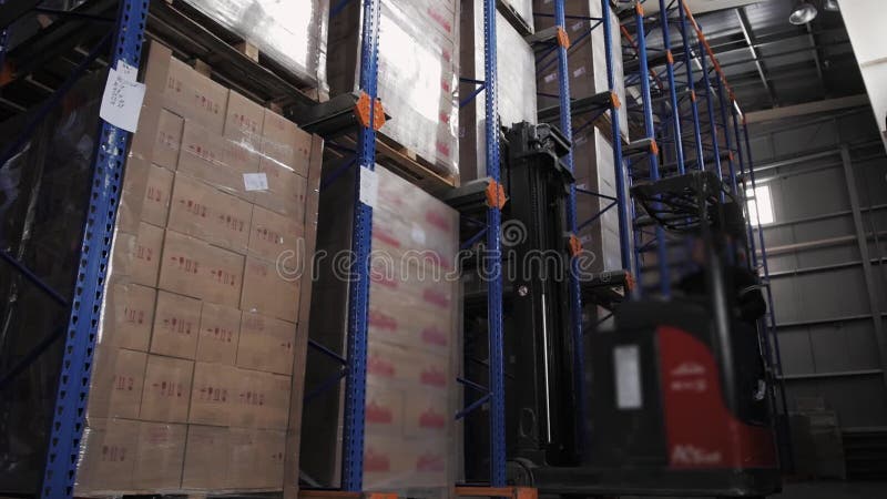Forklift Truck Driver Unloading Pallet in Storage Warehouse Stock Video ...