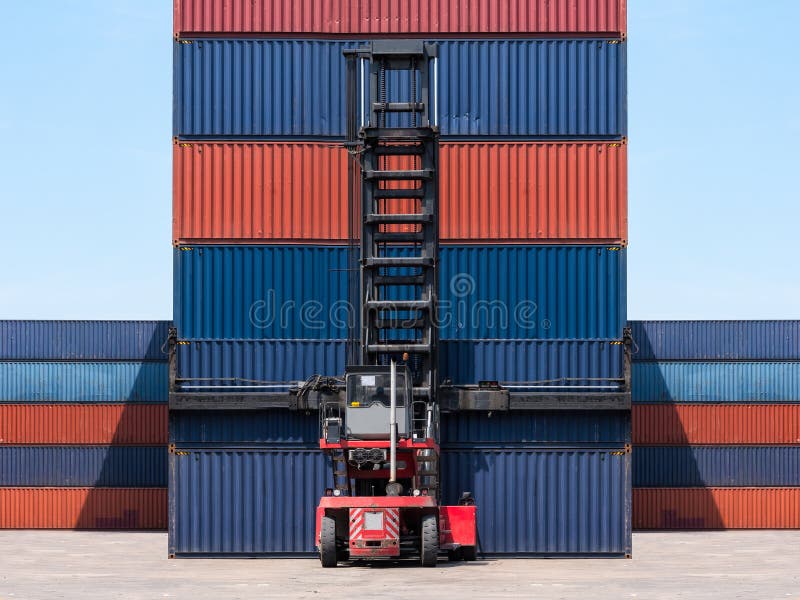Forklift Truck Lifting Cargo Container in Shipping Yard Stock Photo ...