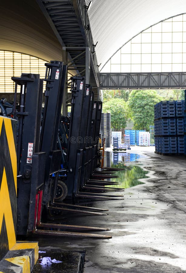 Forklift Trucks Parked in a Warehouse Stock Image - Image of ...