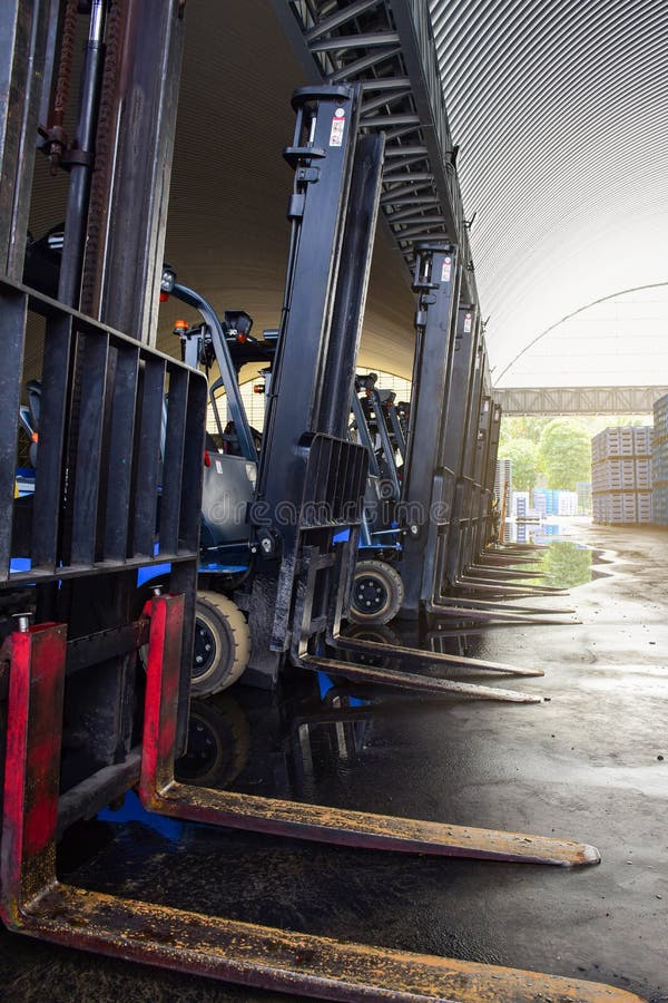 Forklift Trucks Parked in a Warehouse Stock Photo - Image of factory ...