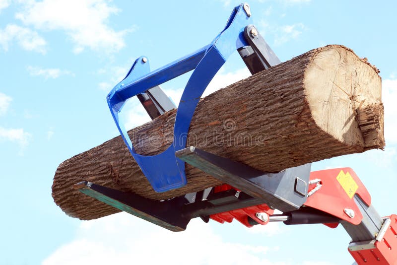 Forklift unloads log stock photo. Image of forest, tractor - 57627322