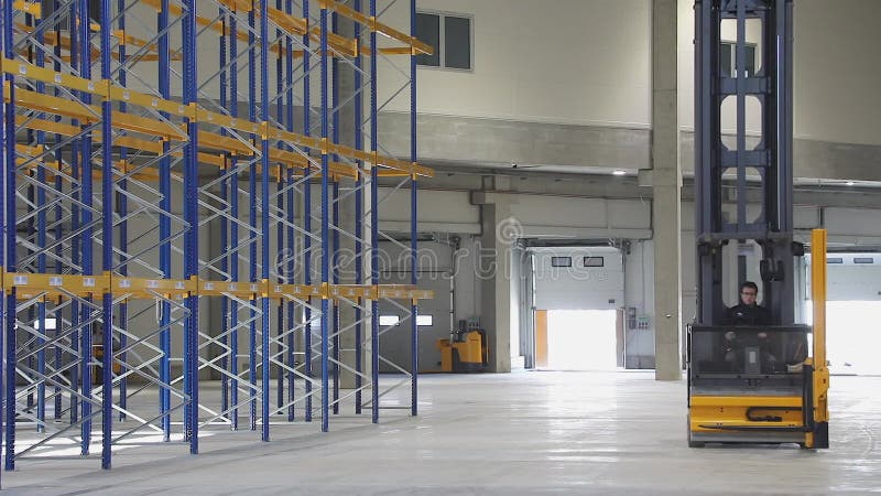 Forklift High Rack Stacker stock video. Video of warehouse - 192566017