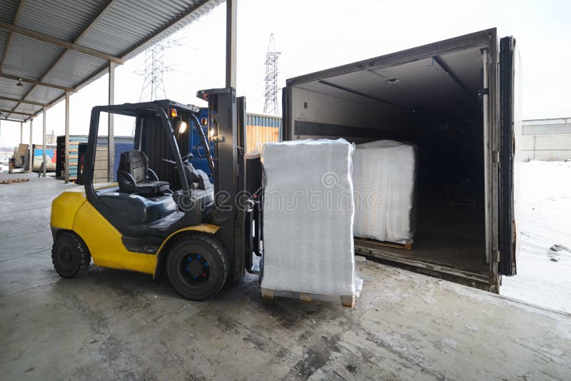 Forklift in Warehouse Loading Box into a Car Outdoors Stock Image ...