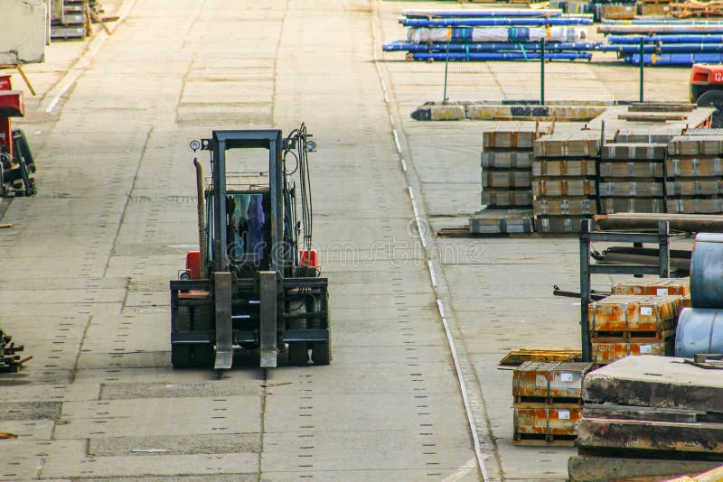 Forklift Works in an Open Warehouse in the Seaport. Stock Image - Image ...