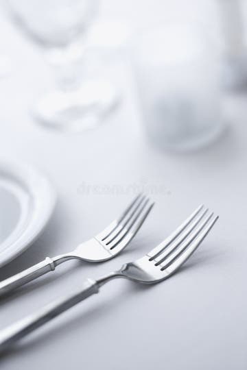 Forks on Dining Table stock image. Image of focus, food - 12753157