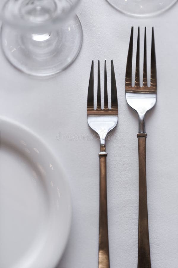 Forks on Dining Table stock image. Image of focus, food - 12753157