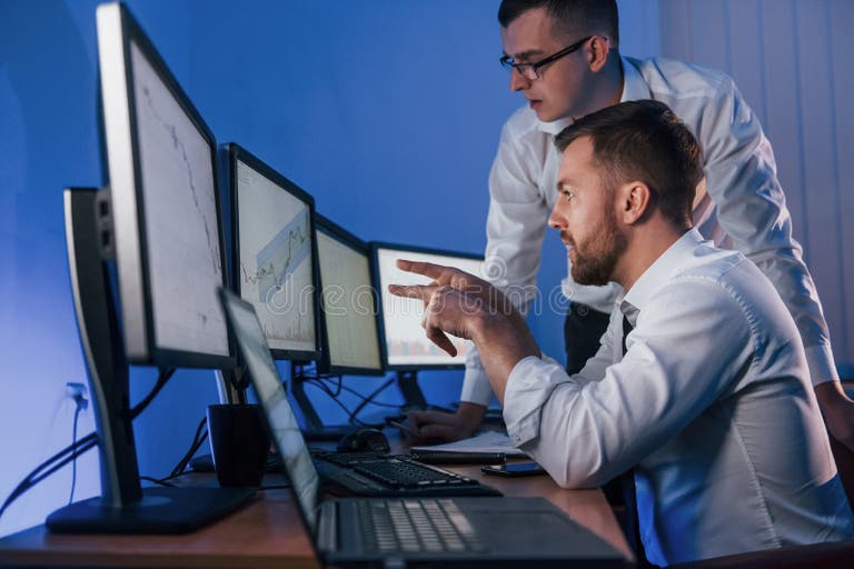 In Formal Clothes. Two Stock Traders Working in the Office with ...