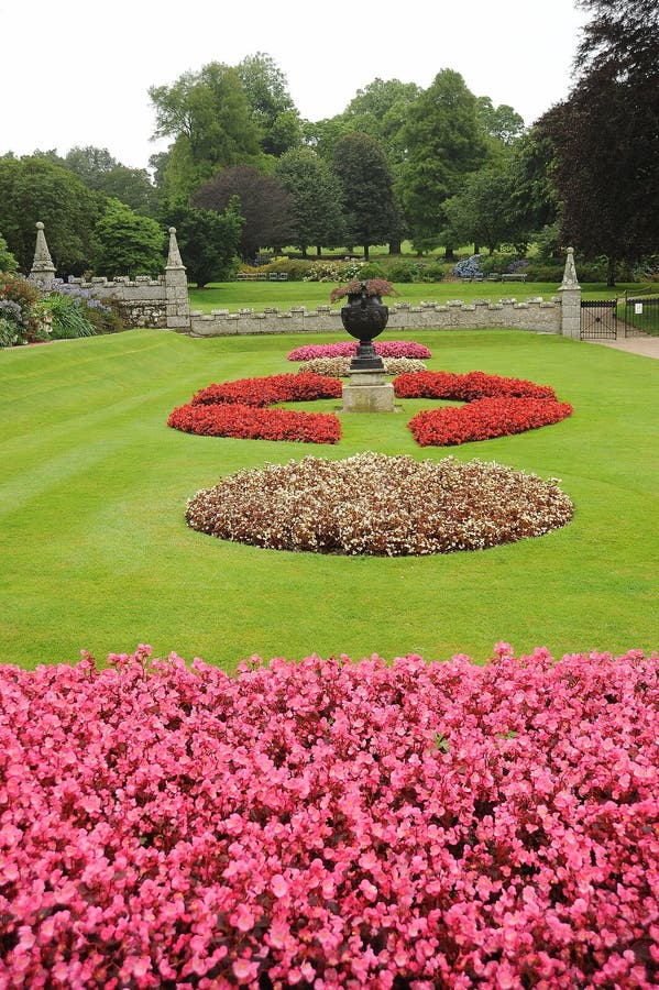 Formal Garden Beds with Urn Stock Image - Image of white, shrubs: 26219817