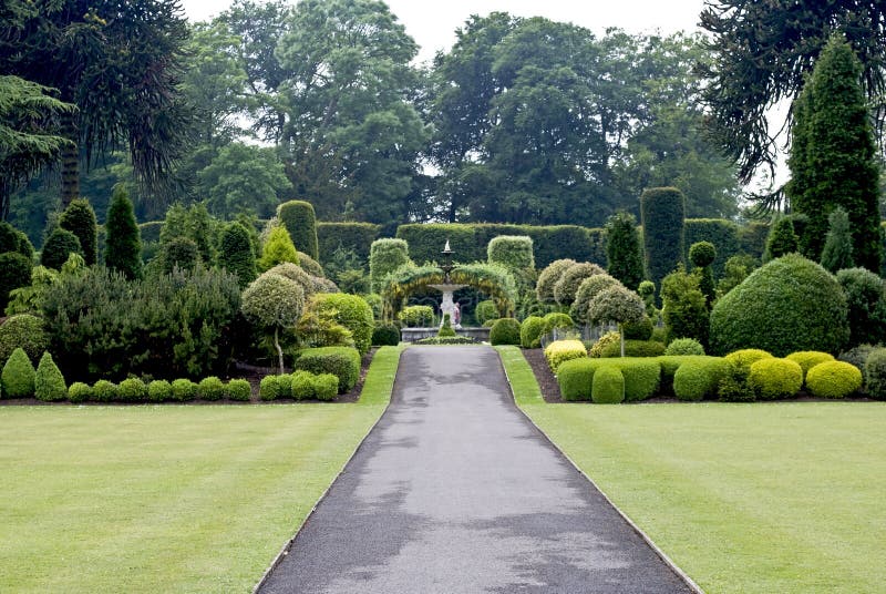 Old Garden Gates with Topiary Shrubs Stock Photo - Image of garden ...