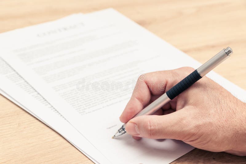 Formalizing the Agreement: Hand Signing the Contract Stock Image ...