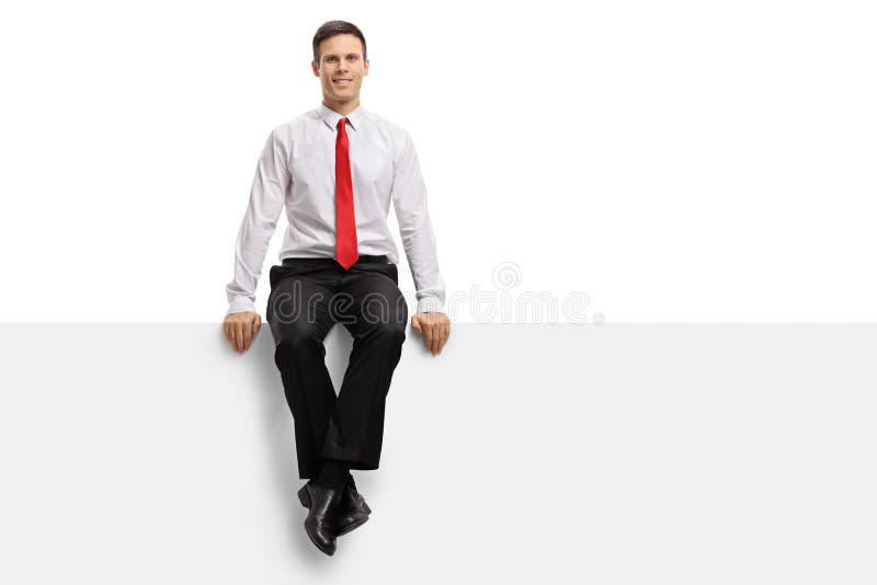 Formally Dressed Guy Sitting on a Panel and Pointing Stock Photo ...