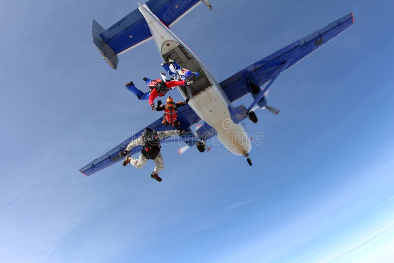 Formation Skydiving. Skydivers are Jumping Out of an Airplane into the ...