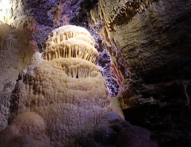 Formations Inside a Rock Cave Illuminated with Dim Lights Stock Image ...