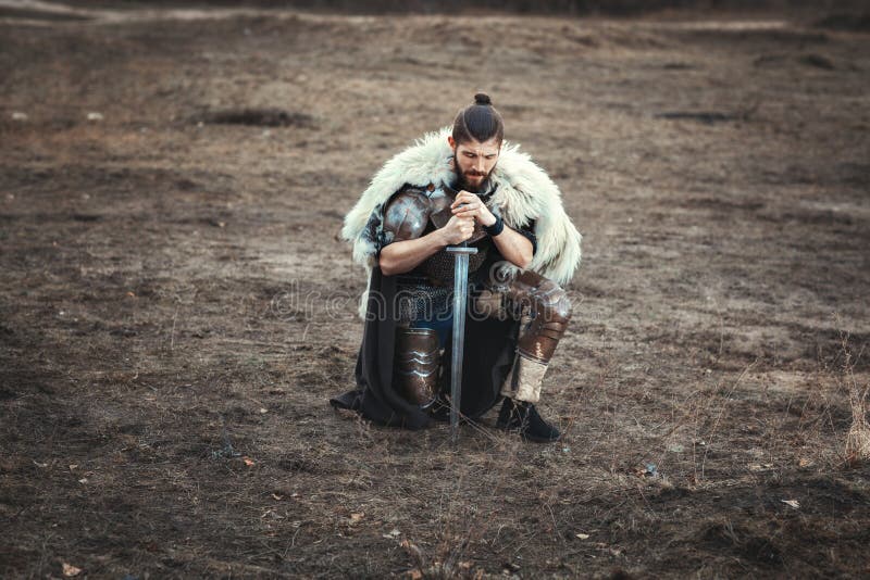 Formidable Man with a Sword in Field Sad. Stock Image - Image of ...