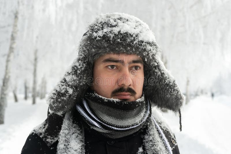 Formidable Russian Man in a Winter Hat and Scarf with a Stern Look ...