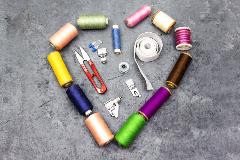Forming a Heart Shape with a Collection of Thread Spools and Sewing ...