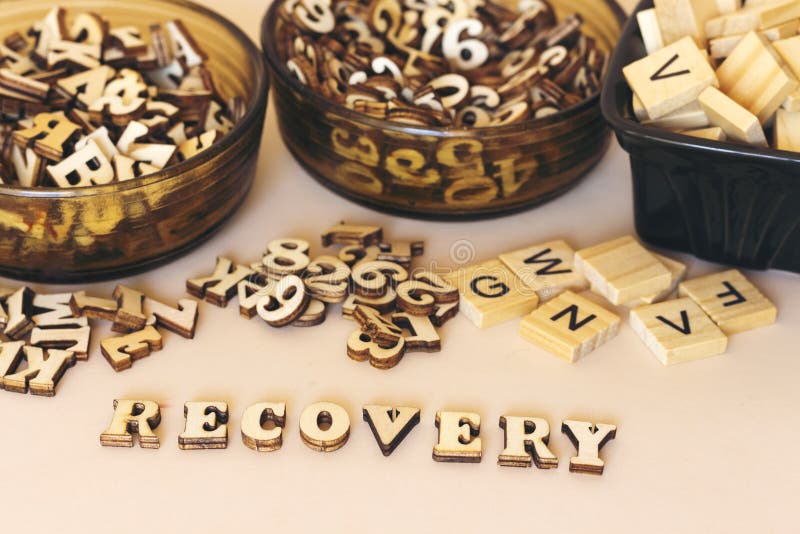 Forming Recovery Text with Wooden Letters . Stock Image - Image of ...