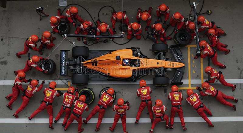 Formula One Pit Stop Team Around 20 Pit Crew, Changing Tires on Race ...