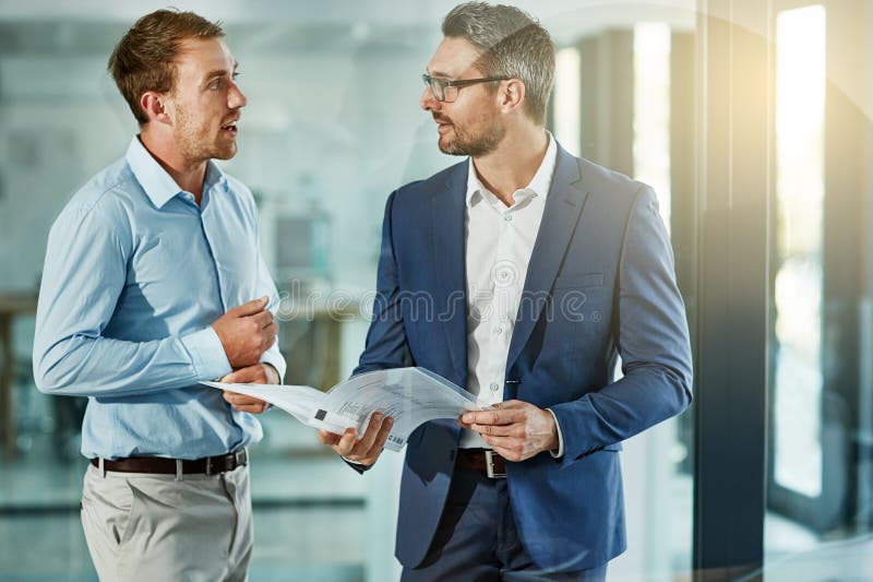 Formulating a Few Brilliant Ideas. Two Businessmen Talking Over Some ...
