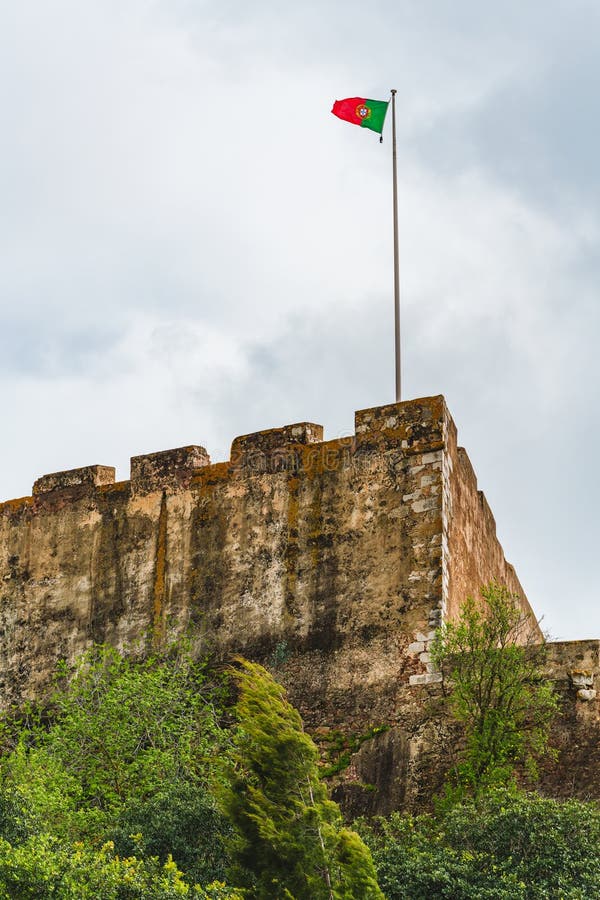 Fortress with the Portuguese Flag Flying High Under a Cloudy Sky Stock ...