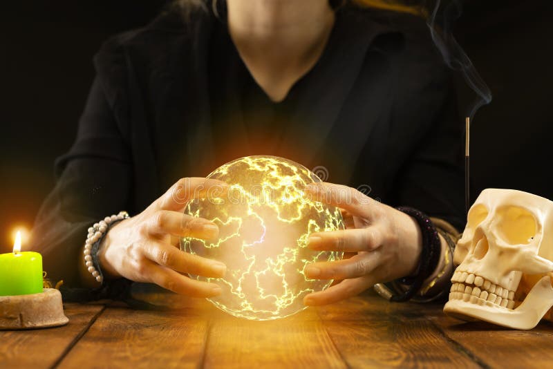 A Fortune-teller or Oracle with Objects for Fortune-telling Holds a ...