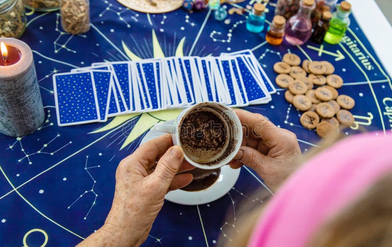 A Fortune Teller Reads Fortunes on Coffee Grounds. Selective Focus ...