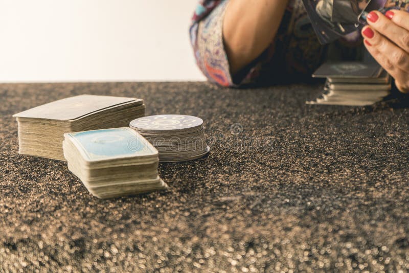 Fortune Teller Shuffling Tarot Cards on a Table Stock Photo - Image of ...