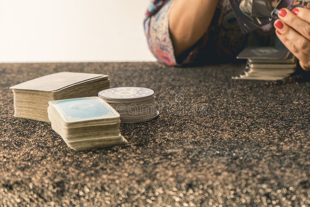 Fortune Teller Shuffling Tarot Cards on a Table Stock Photo - Image of ...