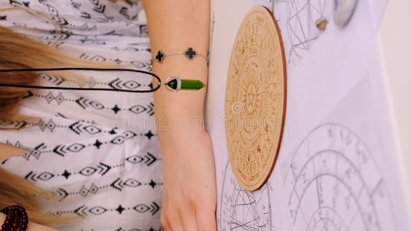 Fortune Telling with a Pendulum on the Hand. Selective Focus Stock ...