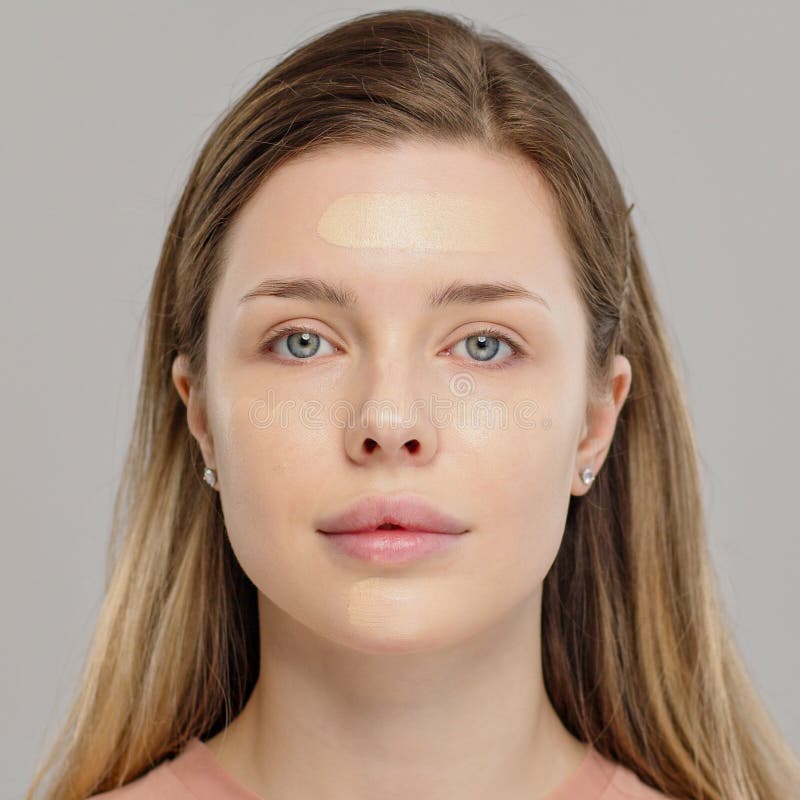Foundation on the Face of a Female Model. Cosmetic Concealer Base on a ...