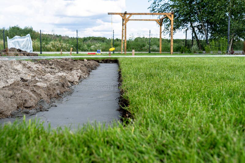 Foundation Footings Poured in a Ditch in the Yard, Building a Terrace ...