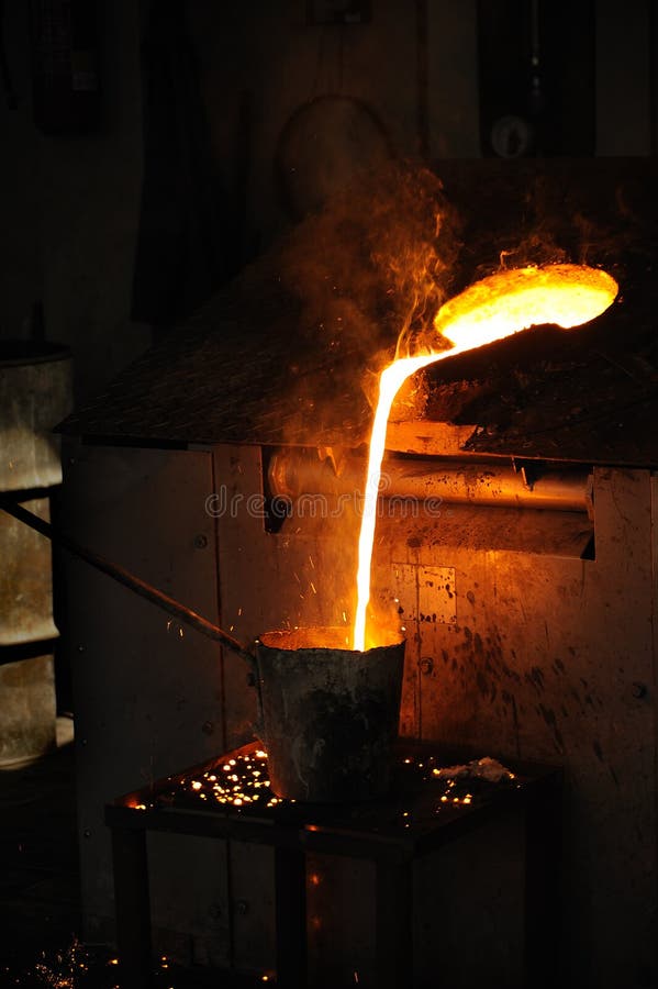 Foundry - Molten Metal Poured from Ladle into Moul Stock Photo - Image ...