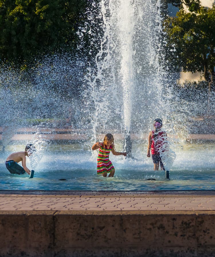 Playing in a Fountain editorial image. Image of children - 46057975