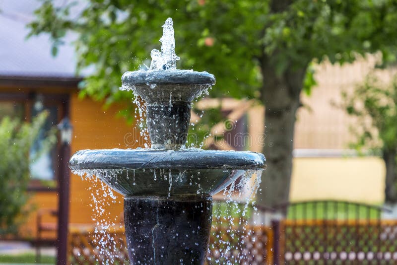 Fountain in the City Park. Flow of Water Flows from the Fountain_ Stock ...