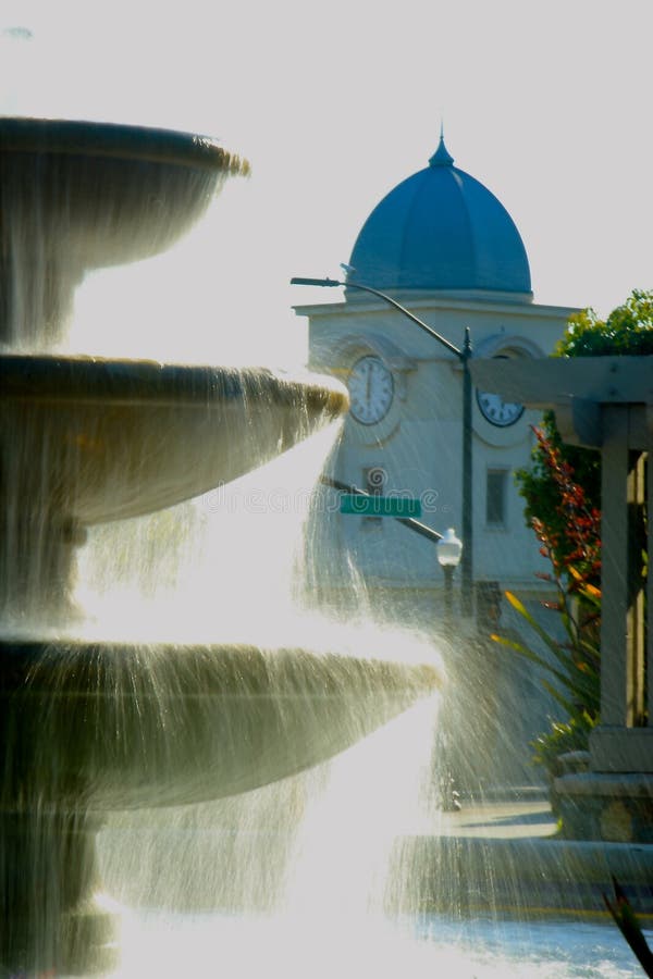 Fountain with clock tower stock photo. Image of bright - 44010698