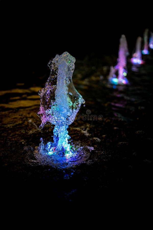 Fountain with Colorfully Lit in the Evening Stock Image - Image of ...