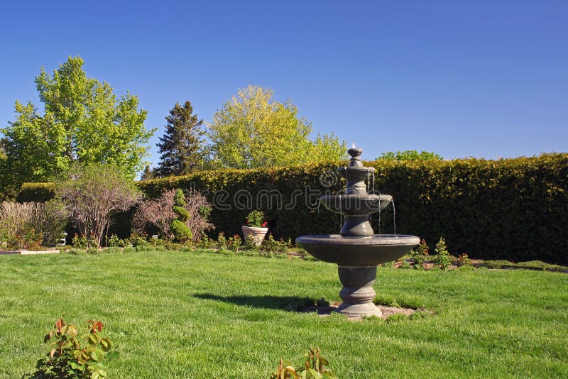 Fountain in empty garden stock image. Image of water, tree - 5596341
